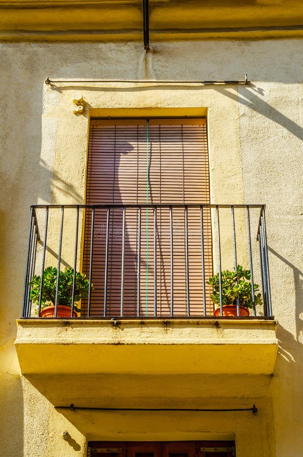 Stylish Balcony with a Metal Railing, Solid Architectural Element, a ...