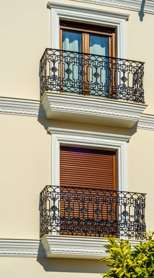 Stylish Balcony with a Metal Railing, Solid Architectural Element, a ...