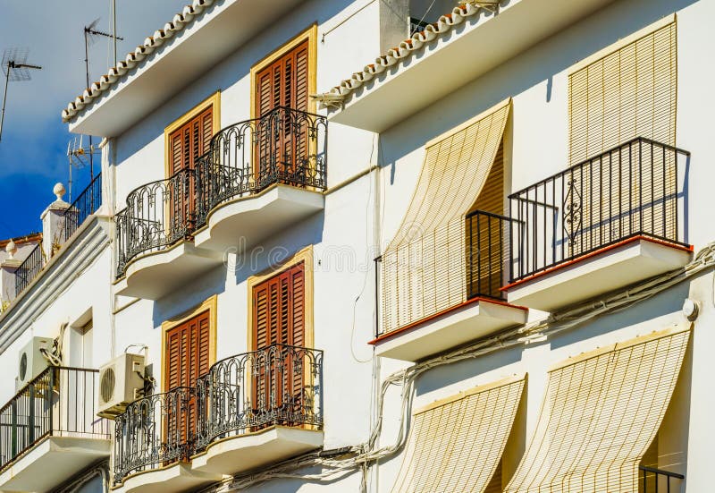 Stylish Balcony with a Metal Railing, Solid Architectural Element, a ...