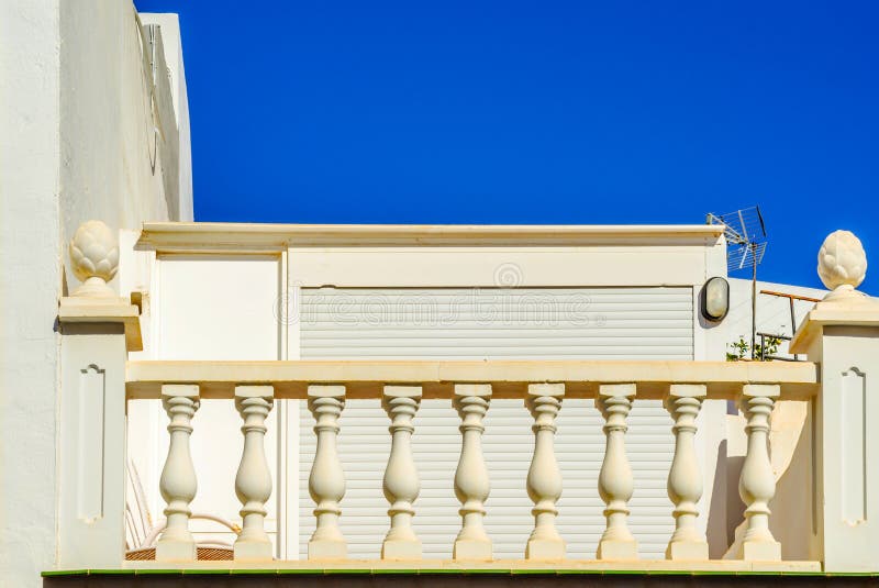 Stylish Balcony with a Metal Railing, Solid Architectural Element, a ...