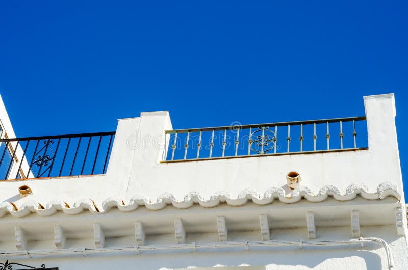 Stylish Balcony with a Metal Railing, Solid Architectural Element, a ...