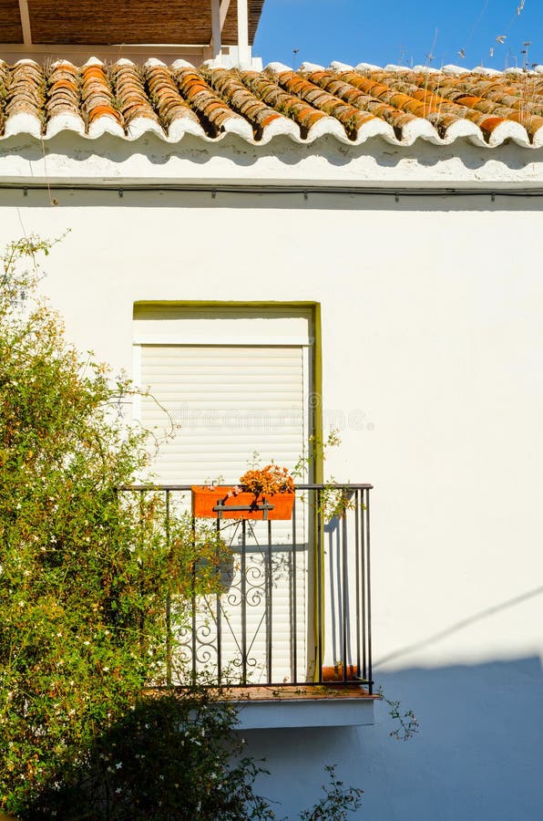 Stylish Balcony with a Metal Railing, Solid Architectural Element, a ...