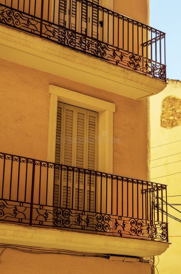 Stylish Balcony with a Metal Railing, Solid Architectural Element, a ...