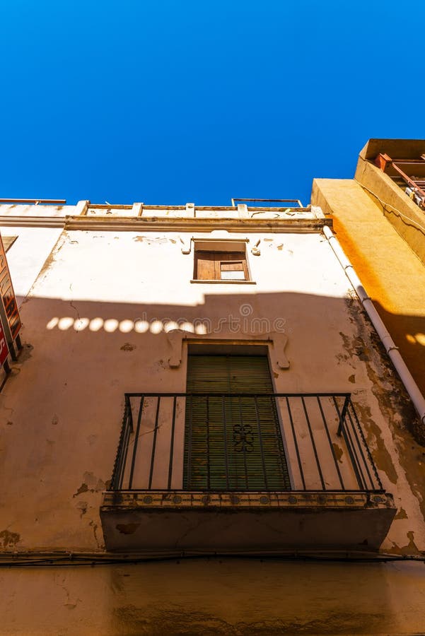 Stylish Balcony with a Metal Railing, Solid Architectural Element, a ...