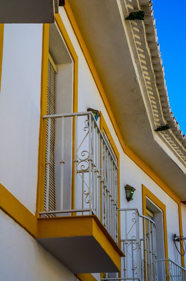 Stylish Balcony with a Metal Railing, Solid Architectural Element, a ...