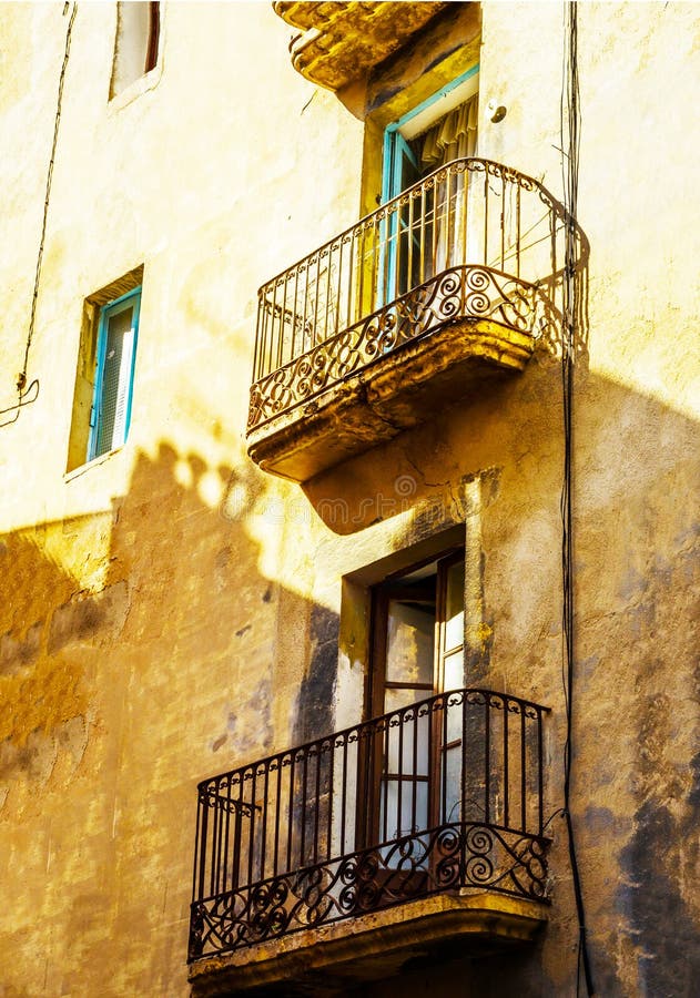 Stylish Balcony with a Metal Railing, Solid Architectural Element, a ...