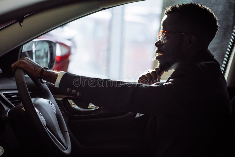 Stylish black man in car stock photo. Image of black - 109200742