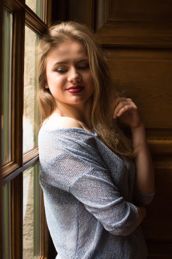 Amazing Blonde Woman With Long Hair Wearing Dress With Naked Shoulders
