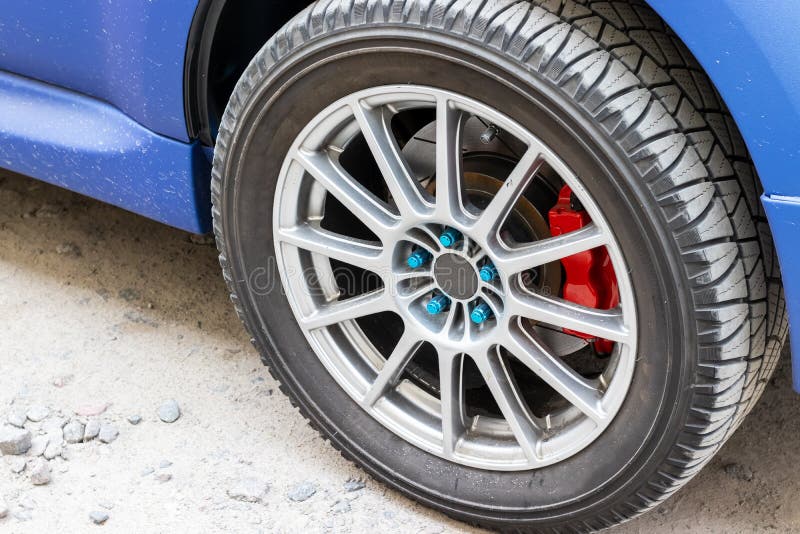 Stylish Blue Car Wheel with Red Brake Caliper and Five-nut Rim. Brake ...