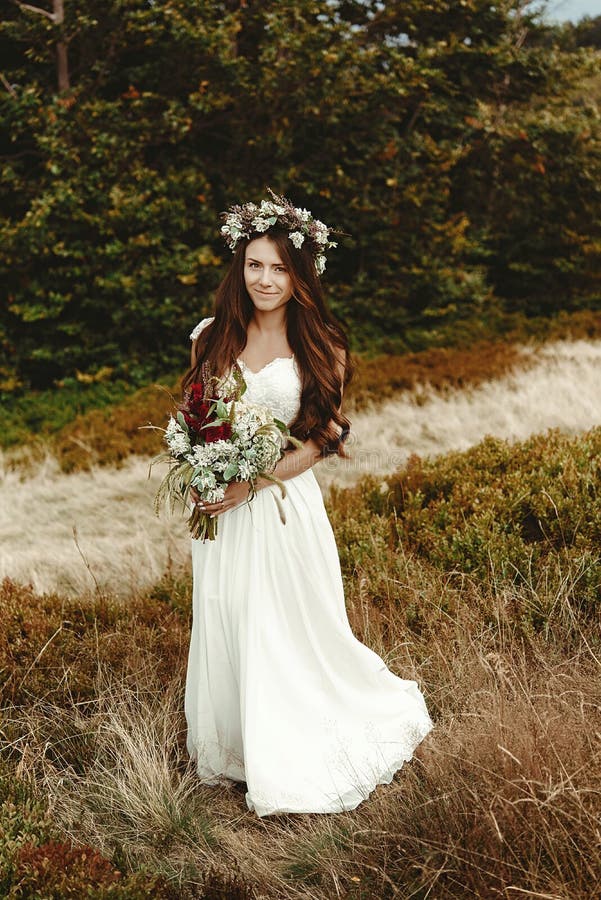 Stylish Bride Posing with Bouquet on Background of Forest, Luxury Boho ...