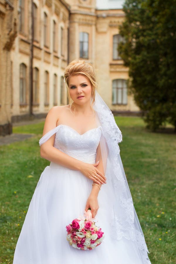 Stylish Bride in a White Dress on the Wedding Day Stock Photo - Image ...