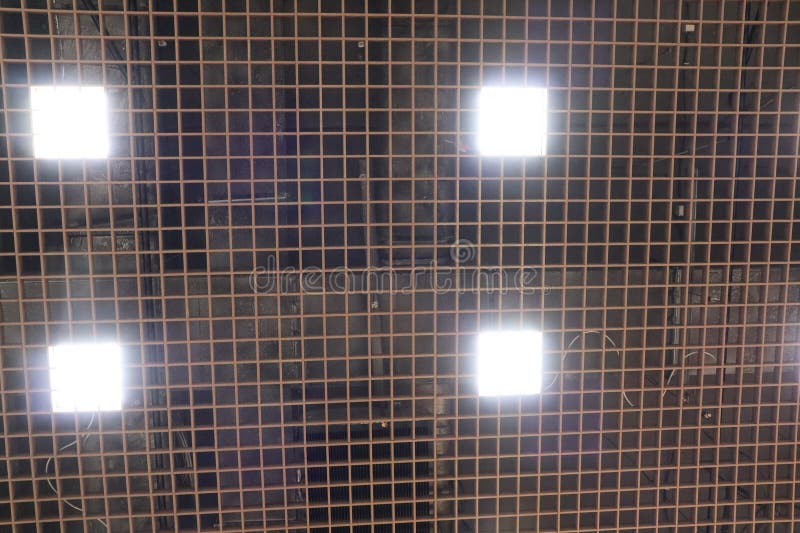 Stylish Bright Ceiling Lights Arranged in a Grid Pattern for a Modern ...