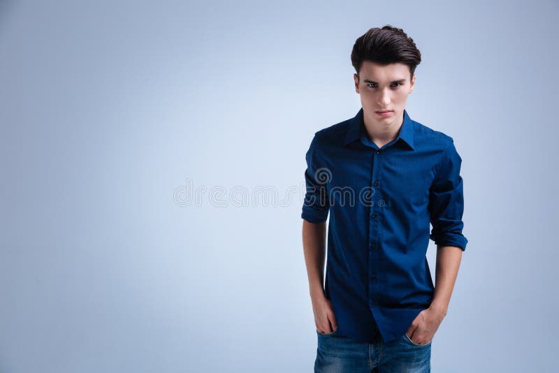 Stylish Brunette Man Putting Hands into Pockets Stock Photo - Image of ...