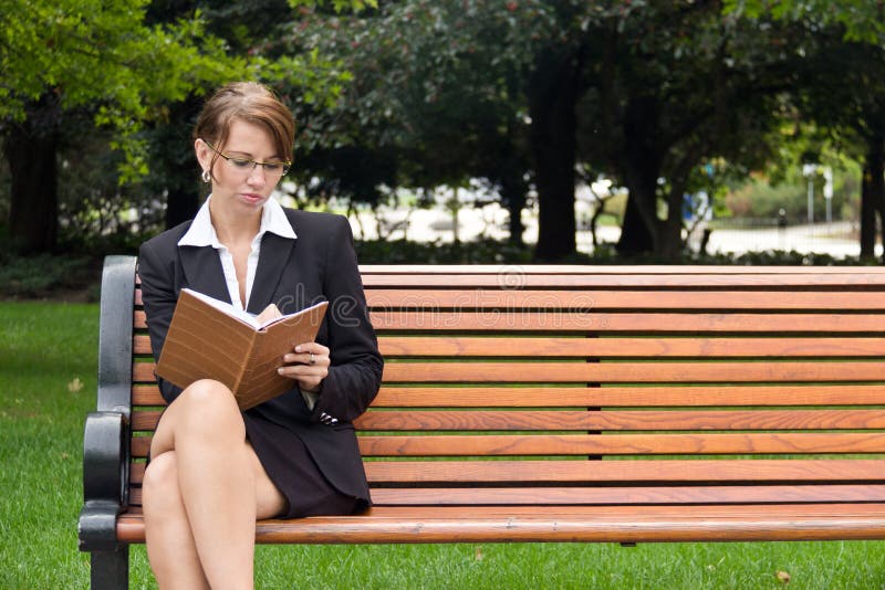 Stylish Business Woman Siting on Park Bench Writing in Notebook Stock ...