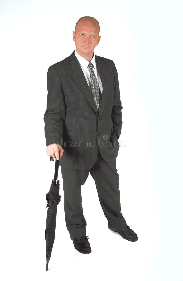 Stylish Businessman Standing Stock Image - Image of dapper, chair: 1013697