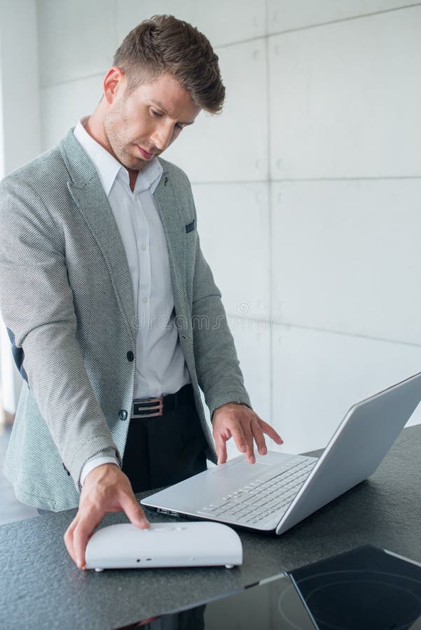 Stylish Businessman Working on a Laptop Stock Photo - Image of elegant ...