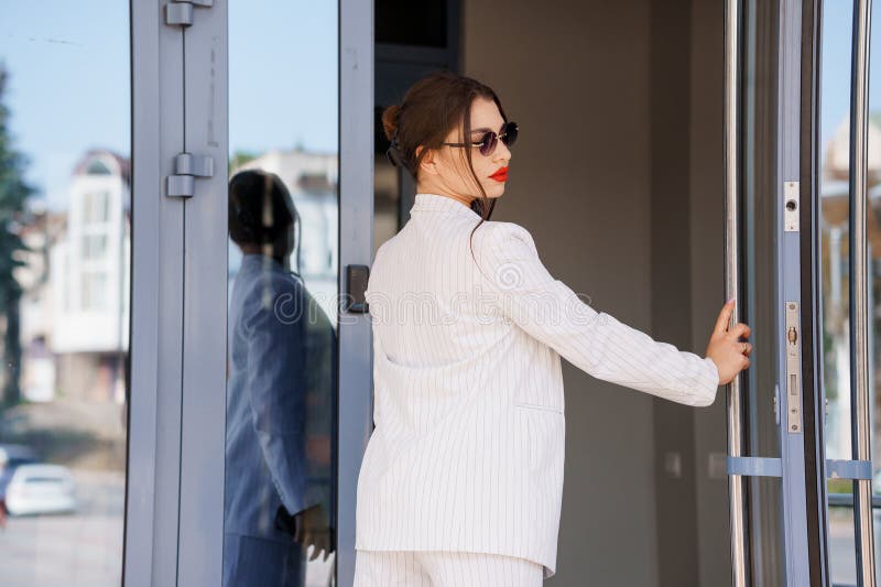 Stylish Businesswoman Stepping into Modern Office with Confidence Stock ...