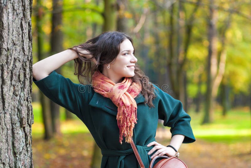 Stylish Caucasian Female Brunette Model Posing In Autumn Forest Stock