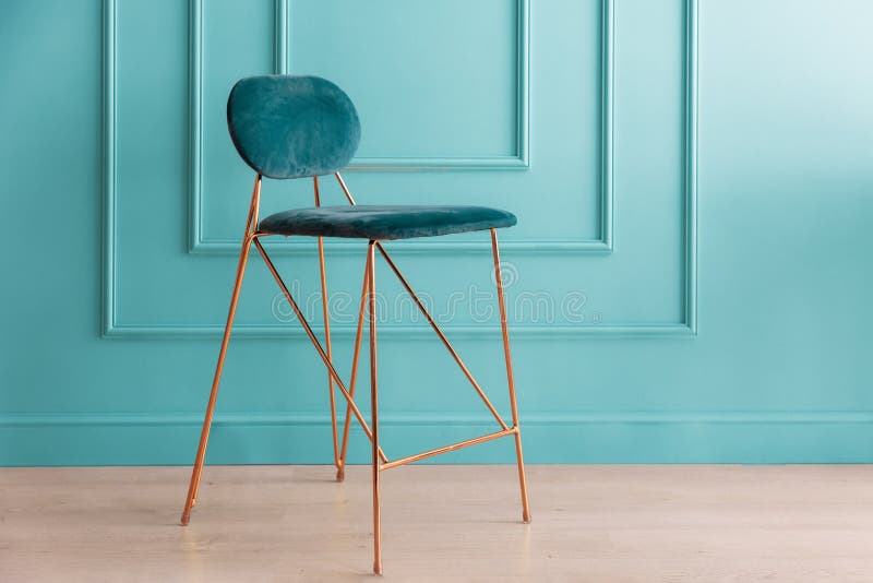 A Stylish Chair Upholstered in Turquoise Velvet Stands on the Parquet ... A Stylish Chair Upholstered in Turquoise Velvet Stands on the Parquet ...