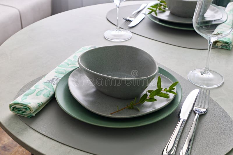 An Elegant Dining Table Setting Featuring Stylish Dinnerware and ...