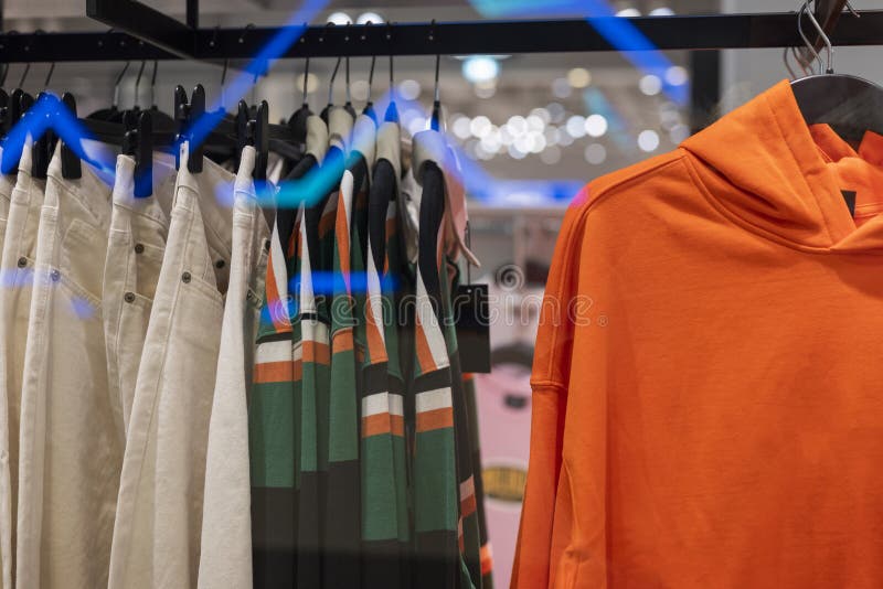 Stylish Clothes Hang on Hangers in a Store Stock Photo - Image of dress ...