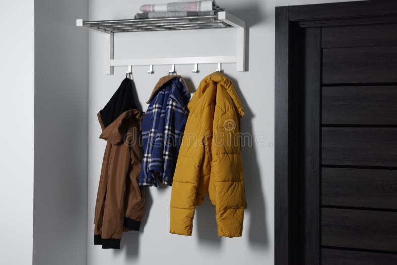 Stylish Coat Rack on White Wall in Hallway. Interior Design Stock Photo ...