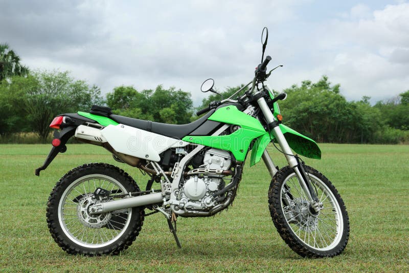 Stylish Cross Motorcycle on Green Grass Outdoors Stock Image - Image of ...
