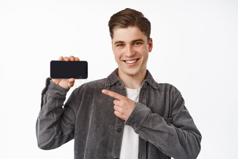 Stylish Gen-z Boy, Guy Pointing at Horizontal Smartphone Screen, Shows ...