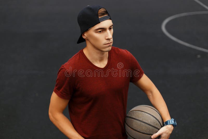 Stylish Guy in a Black Baseball Cap with a Ball in the Stadium. Stock ...