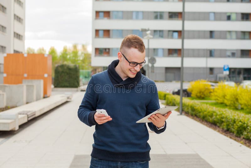 Stylish Guy Connected on Internet with Tablet and Mobile Phone I Stock ...