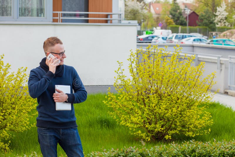 Stylish Guy Connected on Internet with Tablet and Mobile Phone I Stock ...