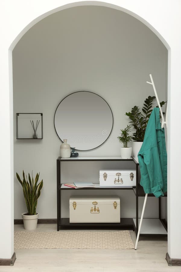 Stylish Hallway Interior with Round Mirror and Rack Stock Image - Image ...
