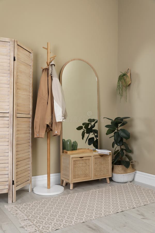 Stylish Hallway Room Interior with Wooden Commode, Coat Rack and Large ...