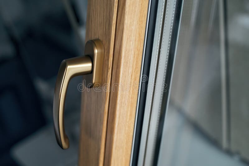 Stylish Handle on the Window Frame in Gold Color. Stock Photo - Image ...