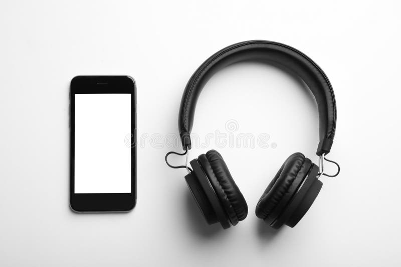 Stylish Headphones and Modern Phone on White Background, Top View Stock ...
