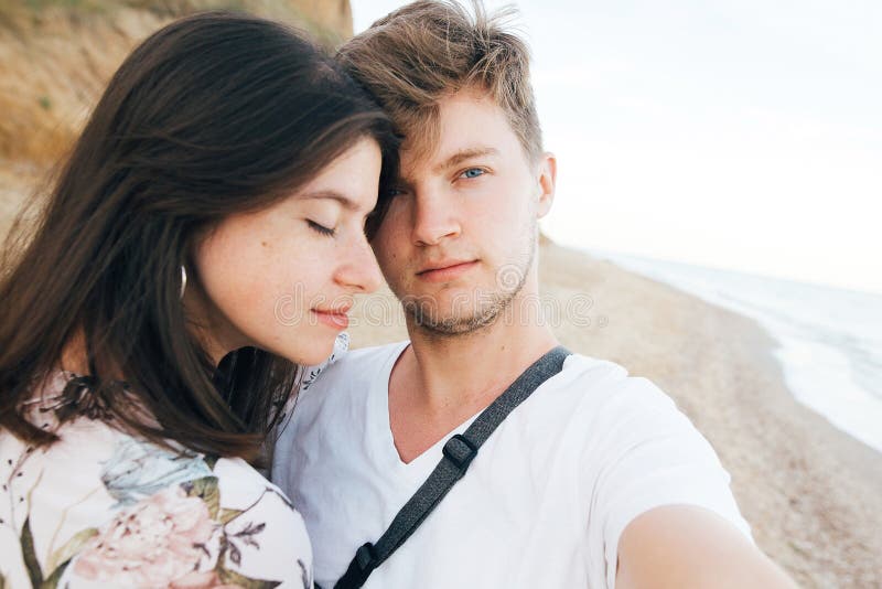 Stylish Hipster Couple Taking Selfie On Beach At Evening Sea Summer