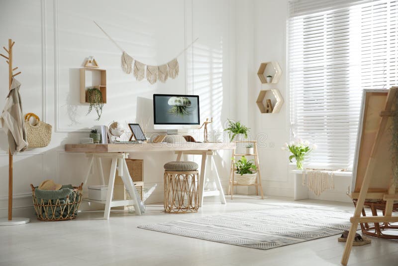 Stylish Home Office Interior with Workplace and Easel Stock Photo ...