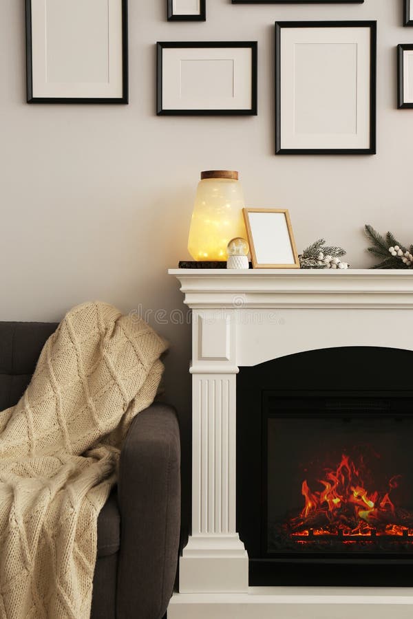 Stylish Interior Decorations on Fireplace Near White Wall Indoors Stock ...