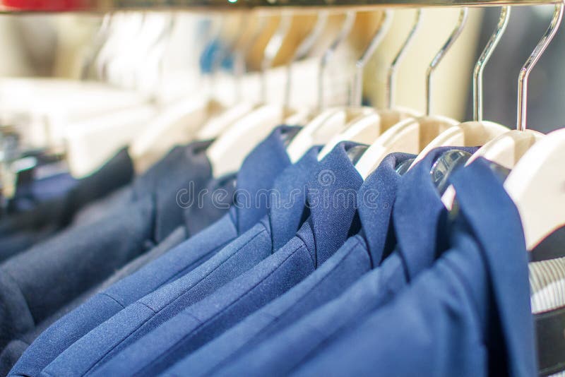 Stylish Jackets Hanging on the Rack in the Storec Stock Photo - Image ...