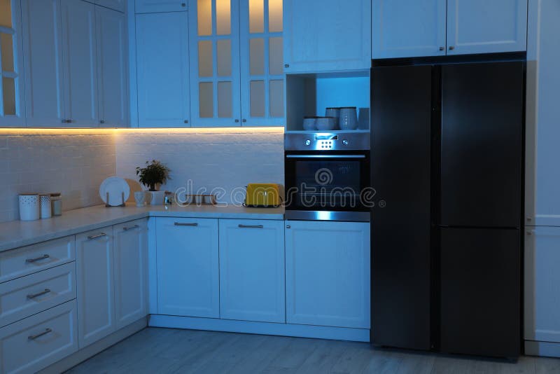 Kitchen Interior with Modern Refrigerator at Night Stock Photo - Image ...