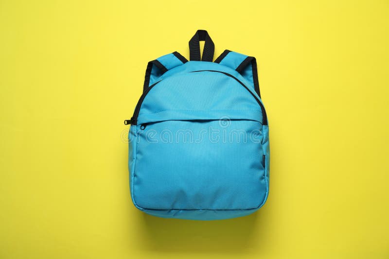 Stylish Light Blue Backpack on Yellow Background, Top View Stock Image ...