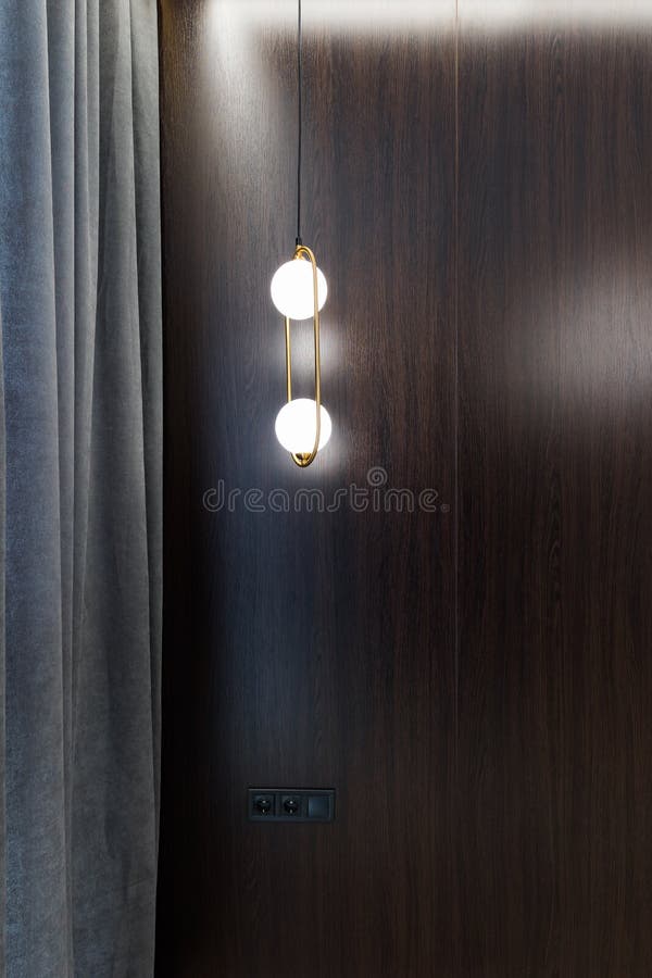 Stylish Light Bulb on the Ceiling in a Room with a Designer Interior ...