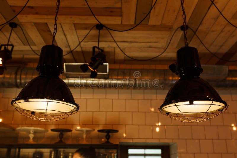 Stylish Lighting Lamps Over a Bar Counter in a Loft Hookah Bar Stock ...