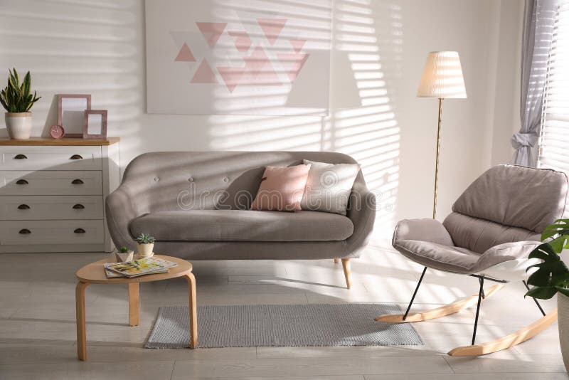 Stylish Living Room Interior with Sofa and Rocking Chair Stock Photo ...