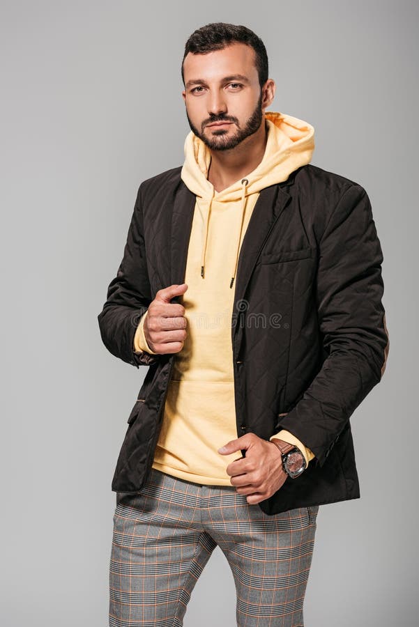 Stylish Male Model in Autumn Outfit Looking at Camera on Grey Stock ...