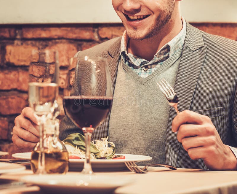 Man Eating At Restaurant Picture. Image: 83058345