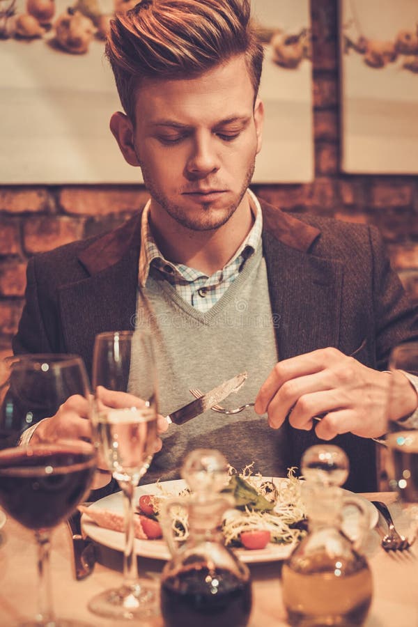 Stylish Man Eating at Restaurant. Stock Photo - Image of friendship ...