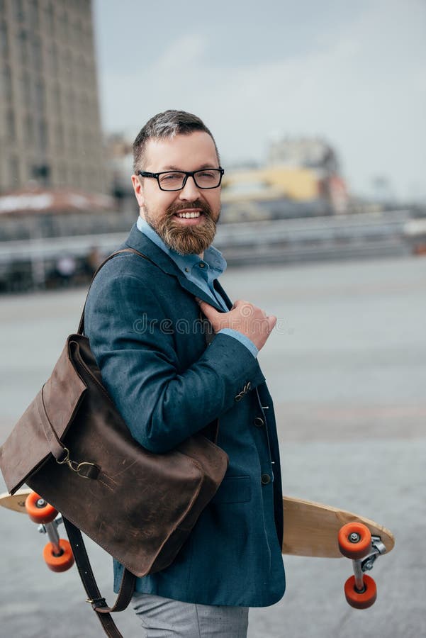 Stylish Man with Leather Backpack and Longboard Stock Image - Image of ...