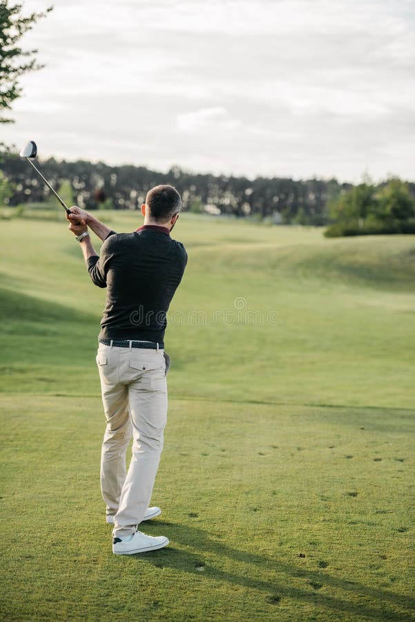 Stylish Man Playing Golf on Golf Course at Daytime Stock Image - Image ...