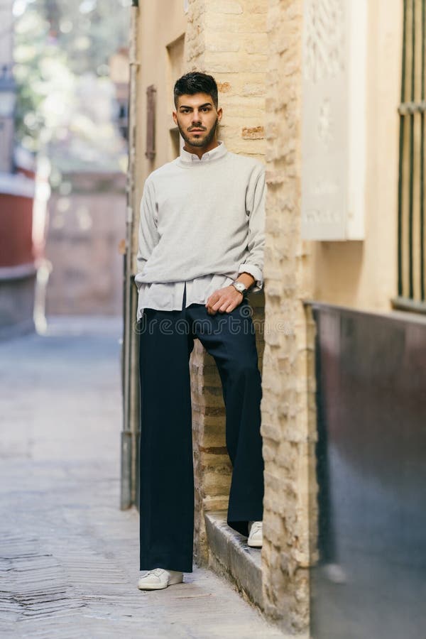 Stylish Man Posing while Looking at the Camera with a Cocky Expression ...